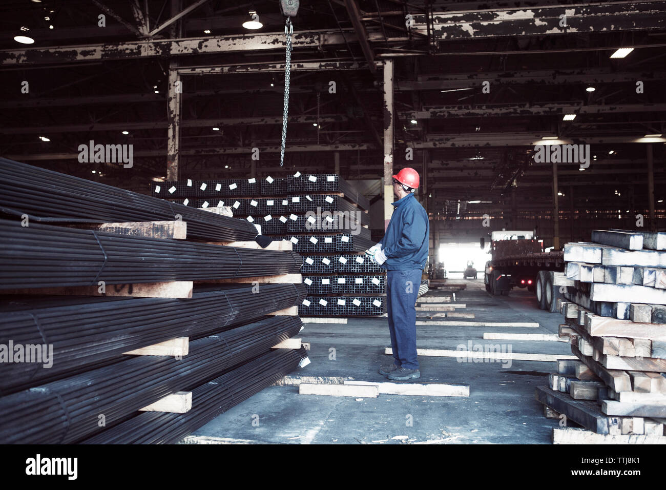 Side view of man working in warehouse Stock Photo - Alamy