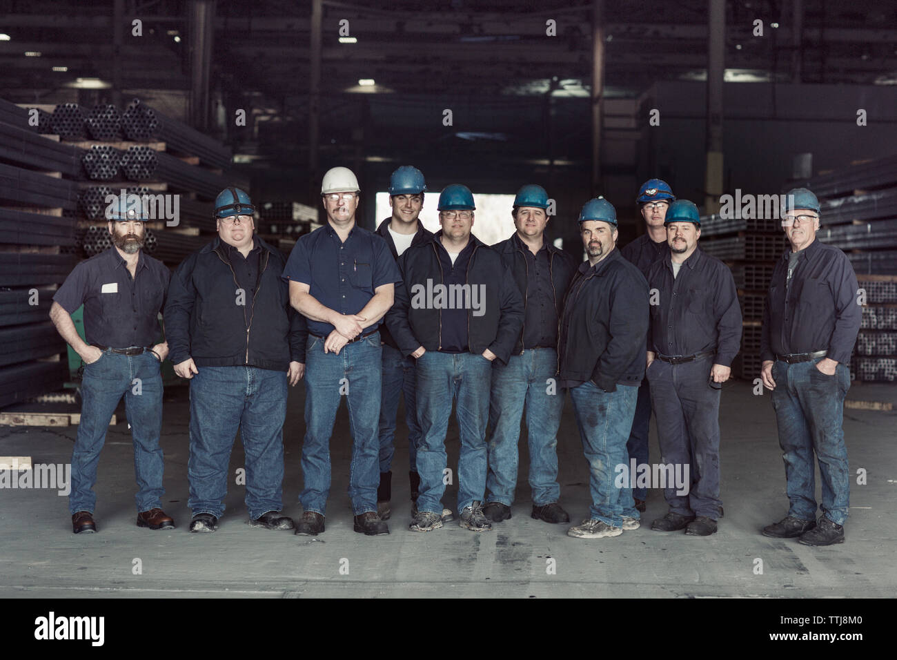Portrait of manual workers in warehouse Stock Photo - Alamy