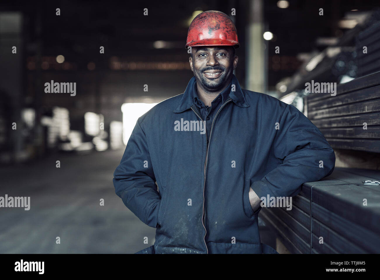 Worker smiling factory hi-res stock photography and images - Alamy
