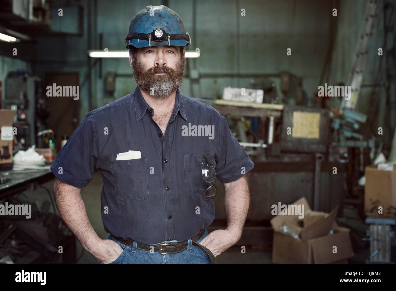 Portrait of manual worker in factory Stock Photo - Alamy