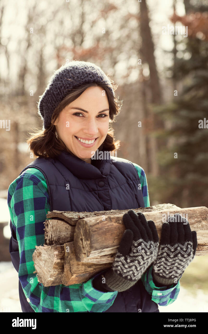 Woman and firewood hi-res stock photography and images - Alamy