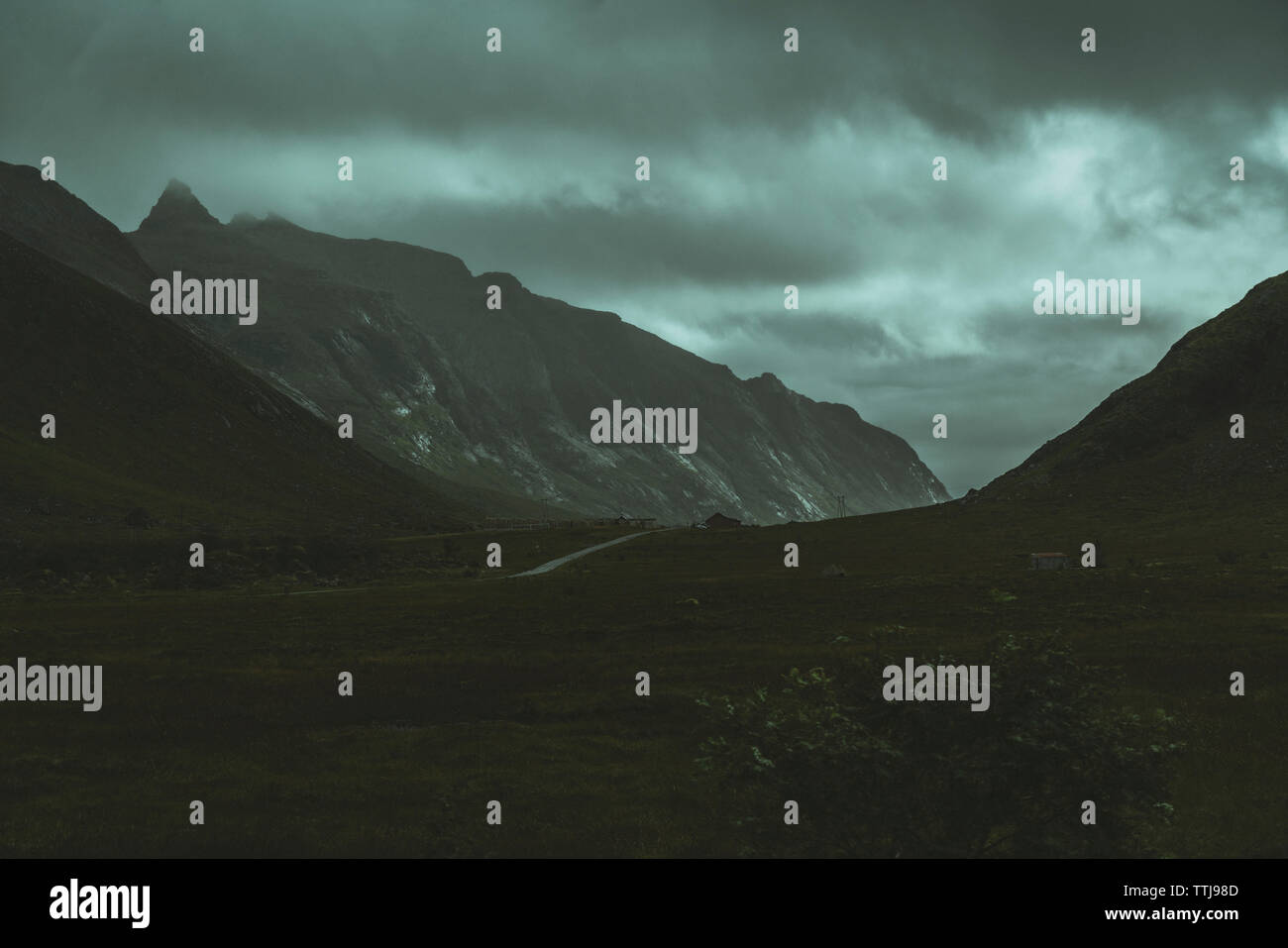 Mountain scenery. Walk in a valley between two mountains that reach a ...