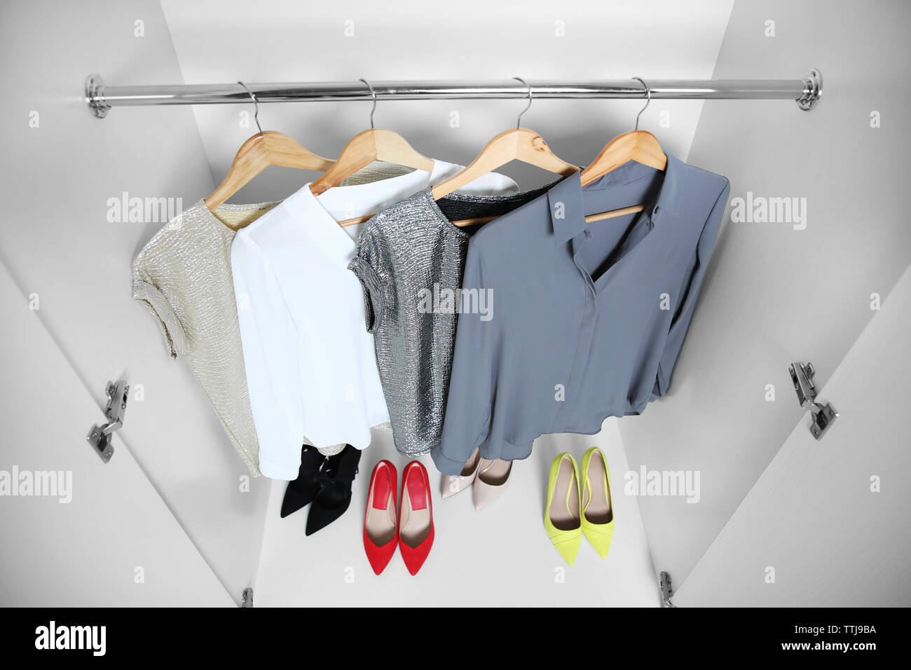 Female clothes hanging in wardrobe Stock Photo - Alamy