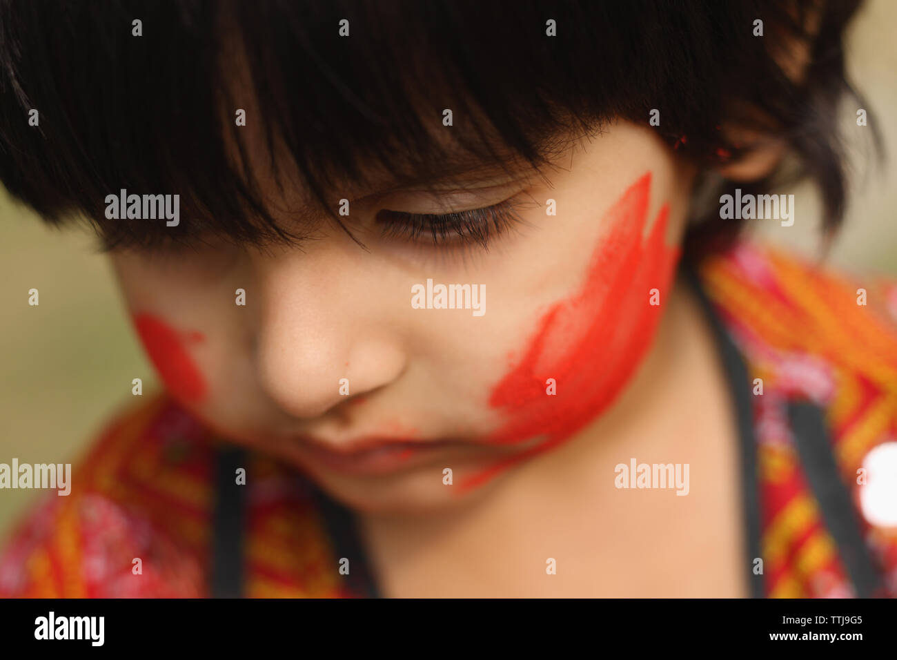 Red gulal on a girls face Stock Photo - Alamy