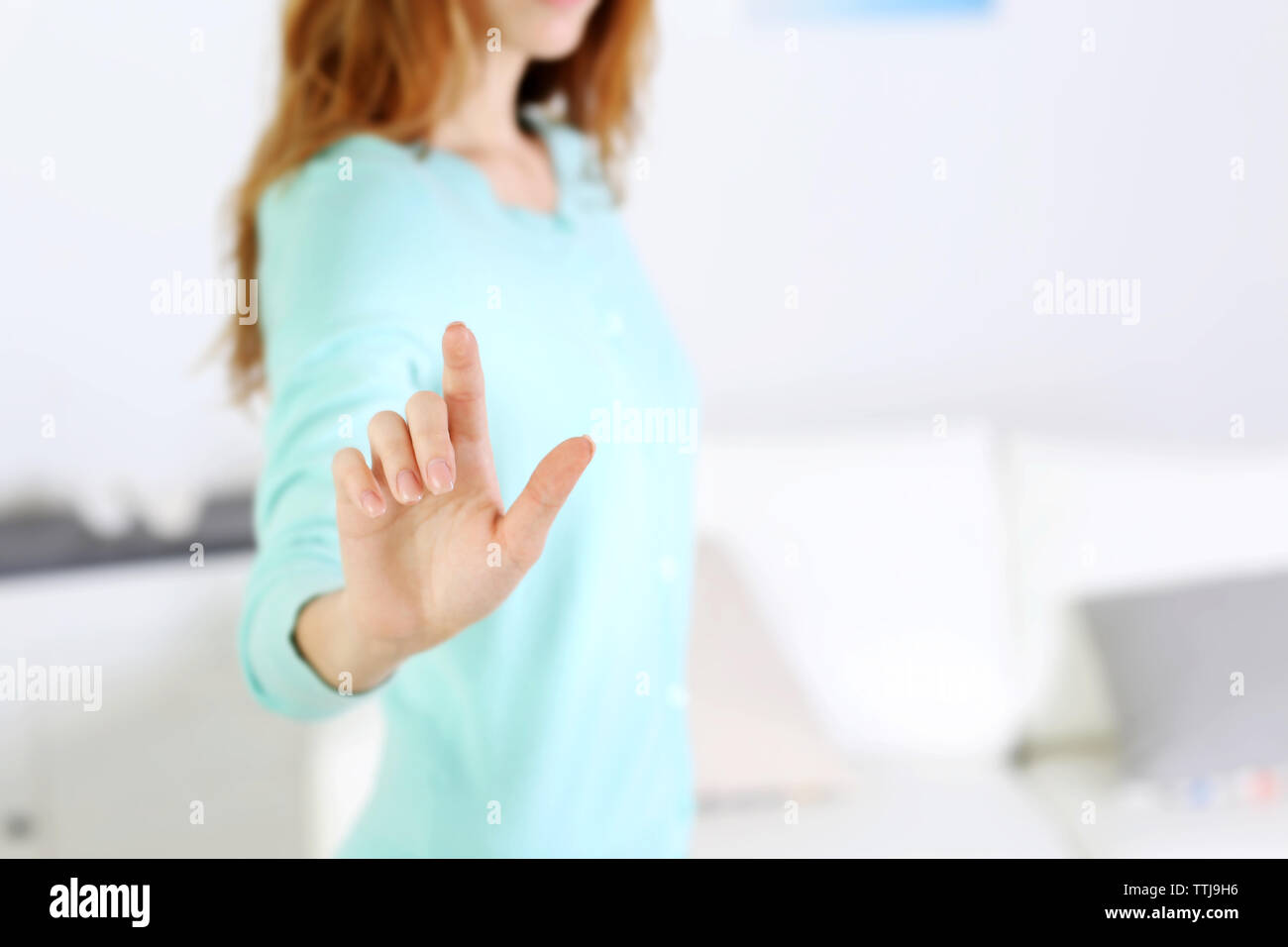 Female hand pointing finger up Stock Photo - Alamy