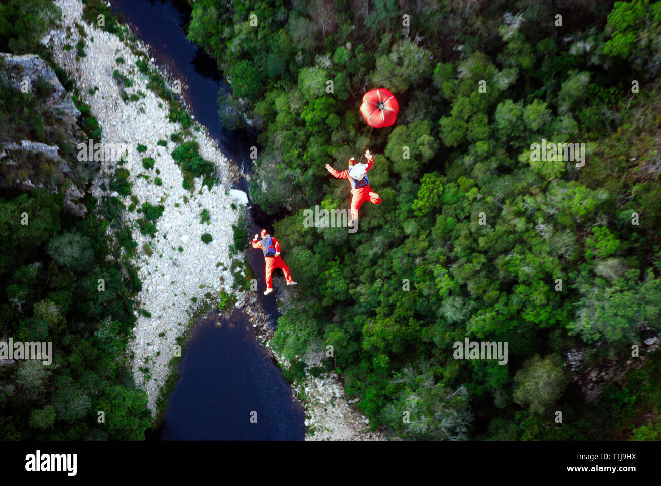 High angle view of men BASE jumping Stock Photo - Alamy