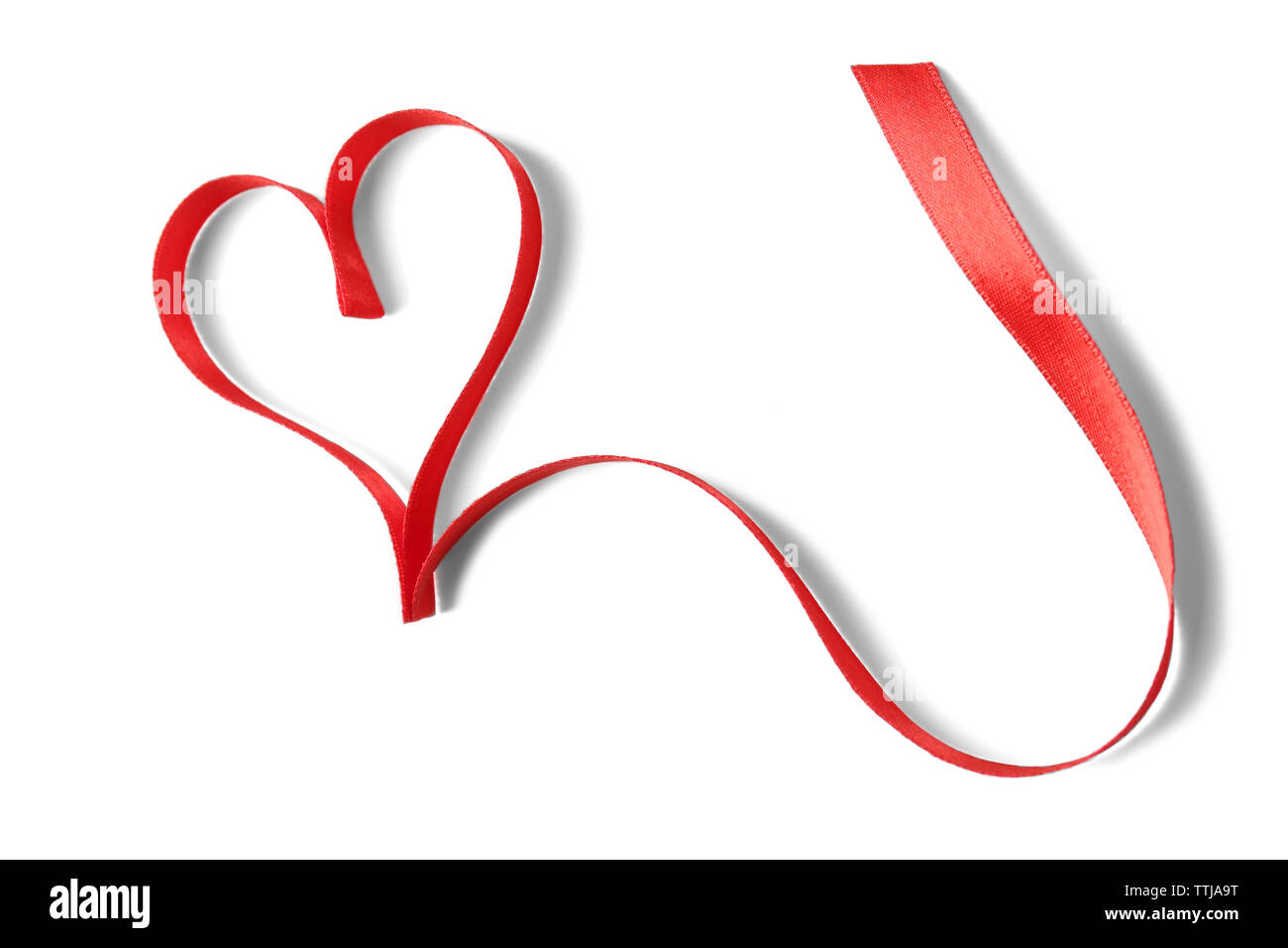 Red heart shaped ribbon isolated on white Stock Photo - Alamy