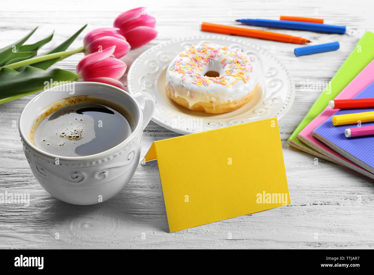 Cup of fresh coffee and note on wooden background Stock Photo - Alamy
