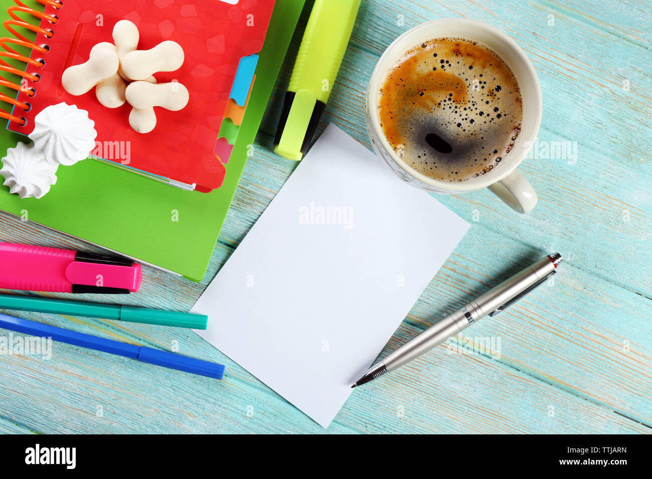 Cup of fresh coffee and note on wooden background Stock Photo - Alamy
