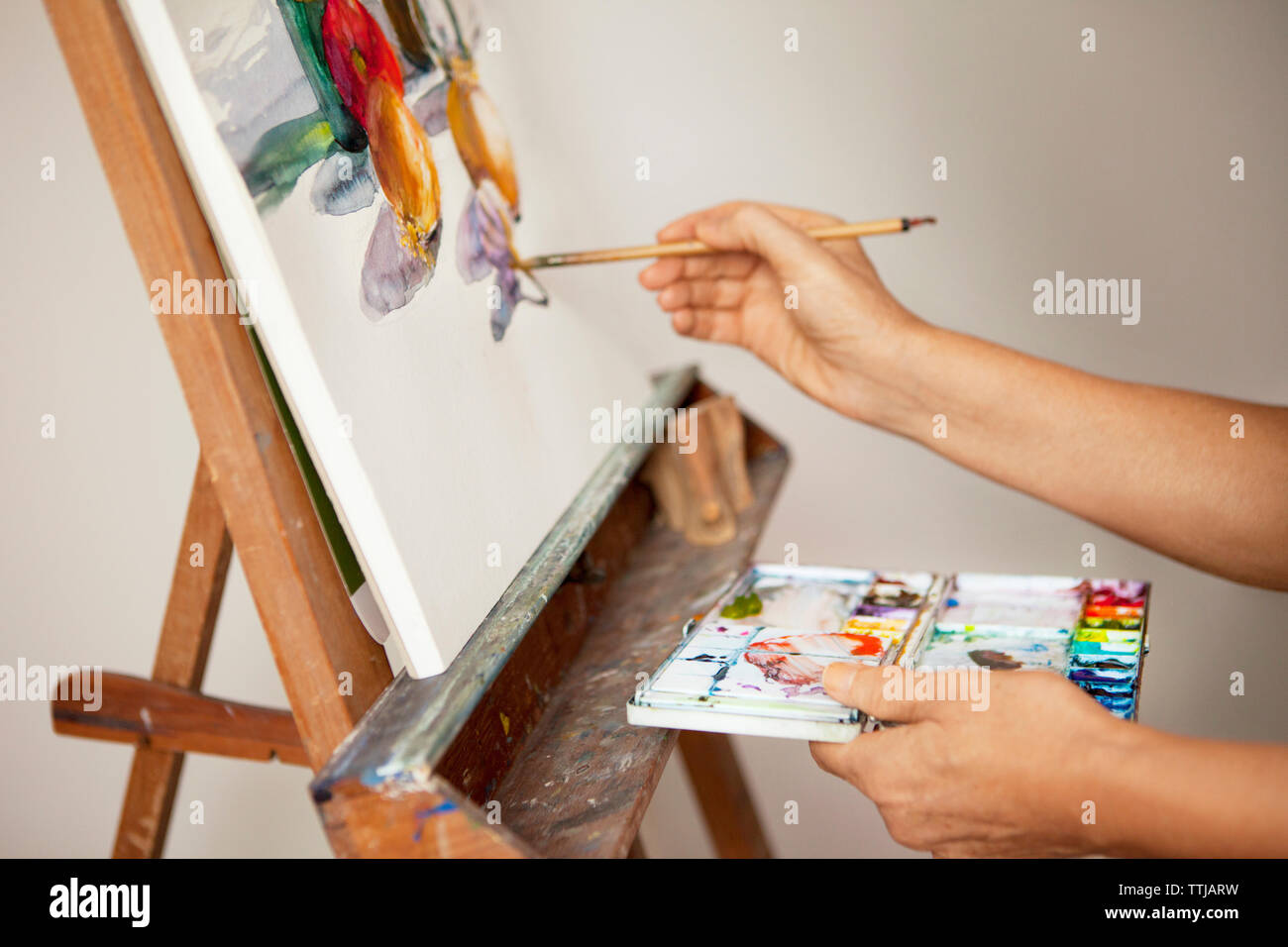 Cropped image of female artist painting in studio Stock Photo - Alamy