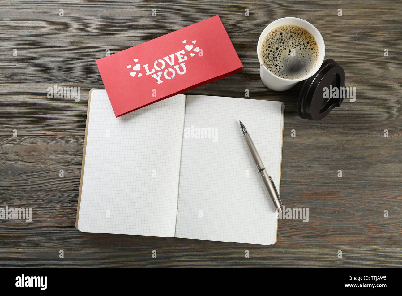 Cup of fresh coffee and notebook on wooden background Stock Photo - Alamy