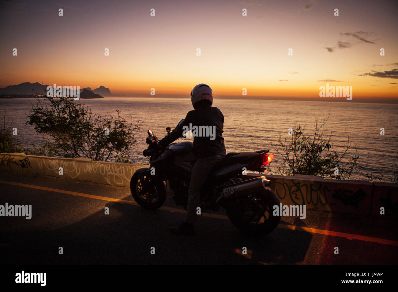 Rear view riding motorcycle hi-res stock photography and images - Alamy