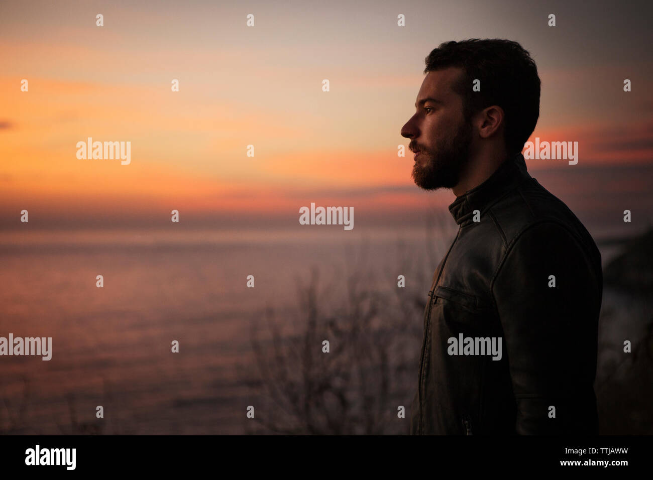 Handsome man standing beach hi-res stock photography and images - Alamy