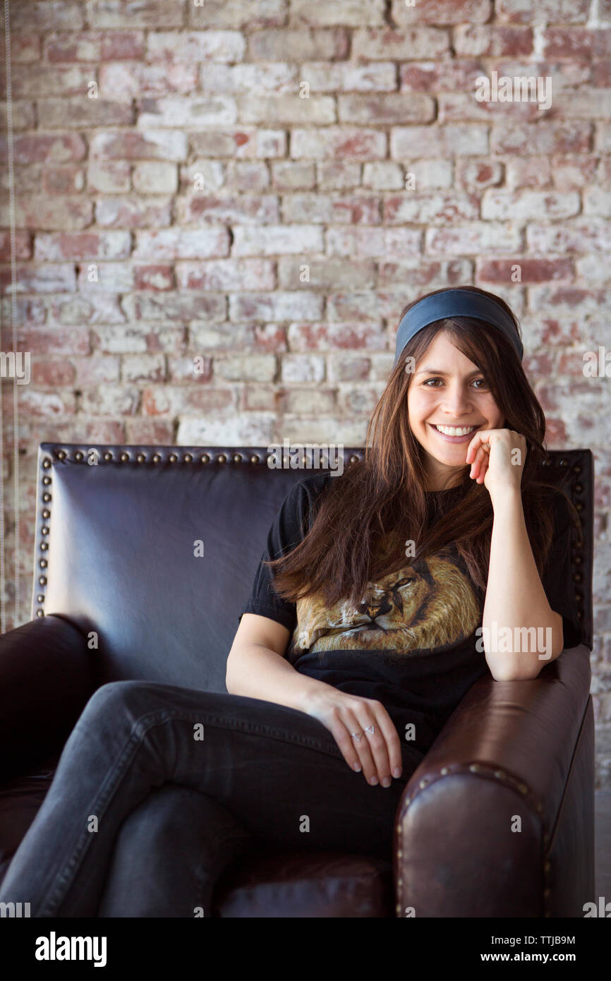 Woman sitting arm chair hi-res stock photography and images - Alamy