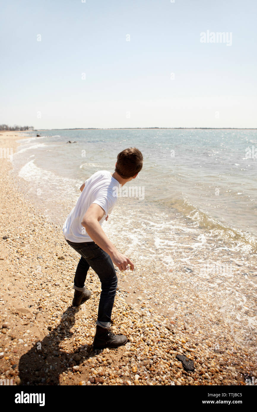 Throwing stone into sea hi-res stock photography and images - Alamy
