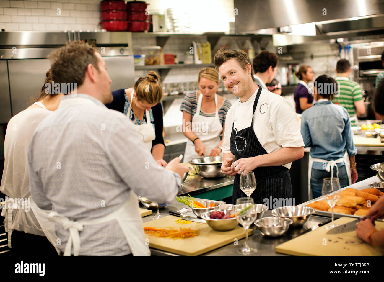 Chef teaching students at commercial kitchen Stock Photo - Alamy