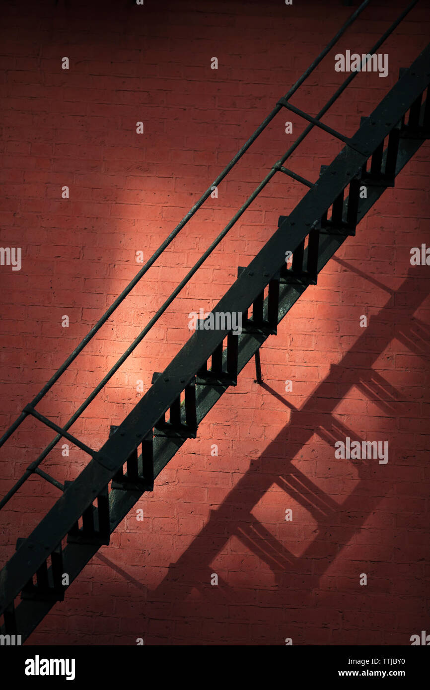 Ladder against brick wall Stock Photo - Alamy