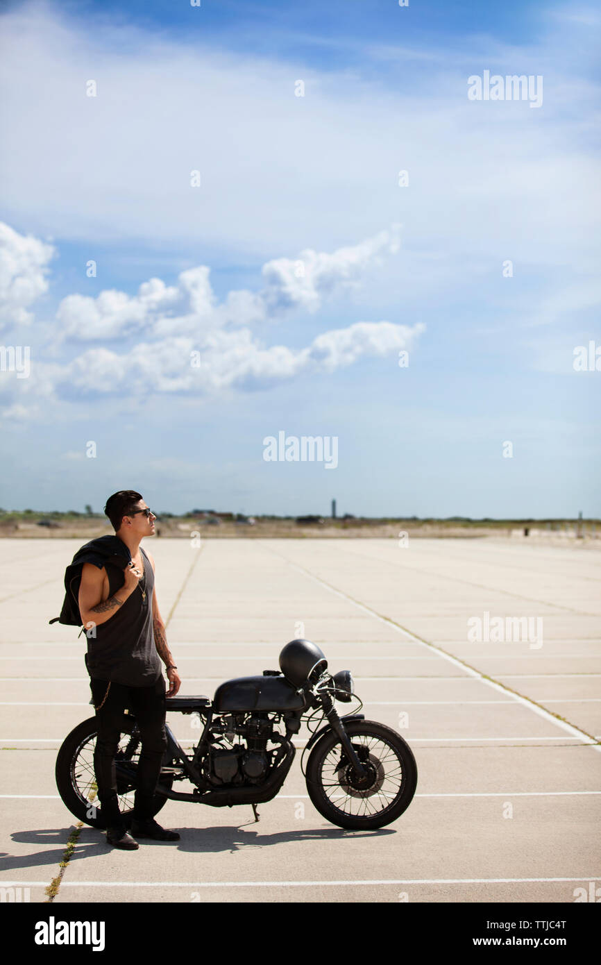 Man carrying motorcycle helmet hi-res stock photography and images - Alamy