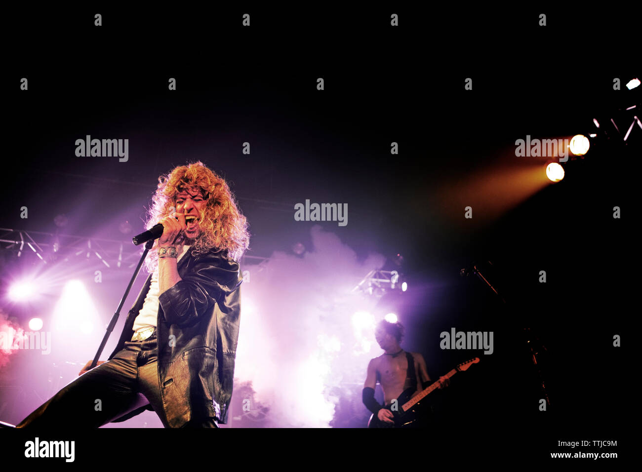 Men singing at rock concert Stock Photo - Alamy