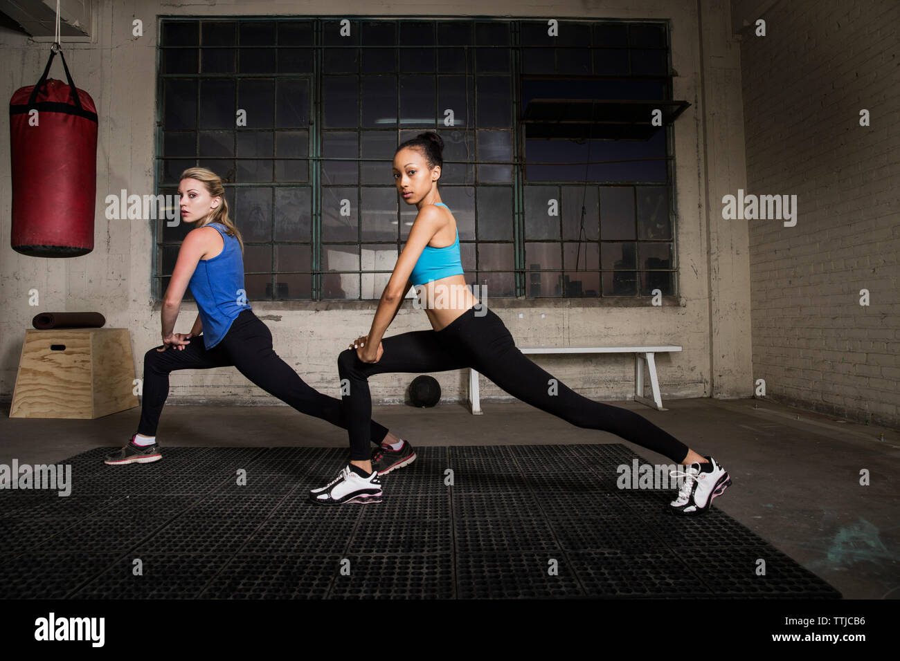Side view of women exercising in gym Stock Photo - Alamy