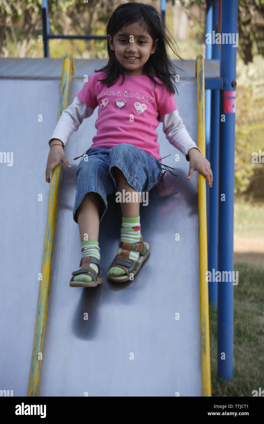 Girl on a slide Stock Photo - Alamy