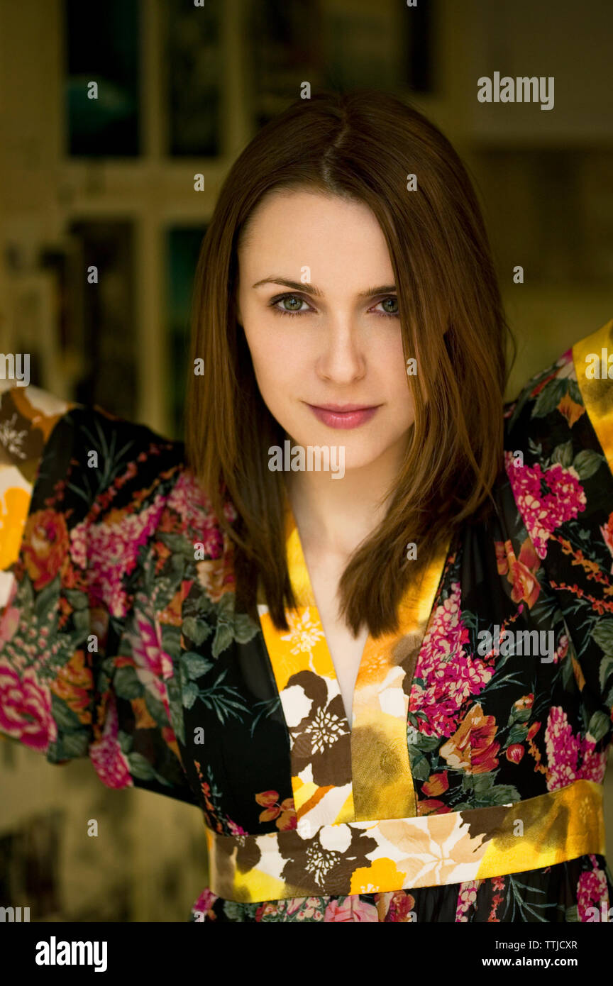 Portrait of woman standing at home Stock Photo - Alamy