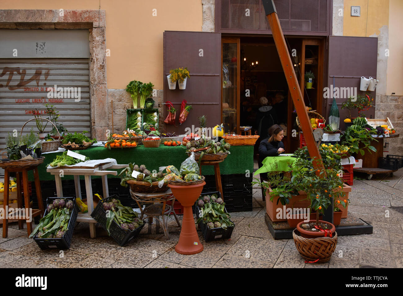 BARI, ITALY - FEBRUARY 9, 2019. Typical market with fresh fruits and ...