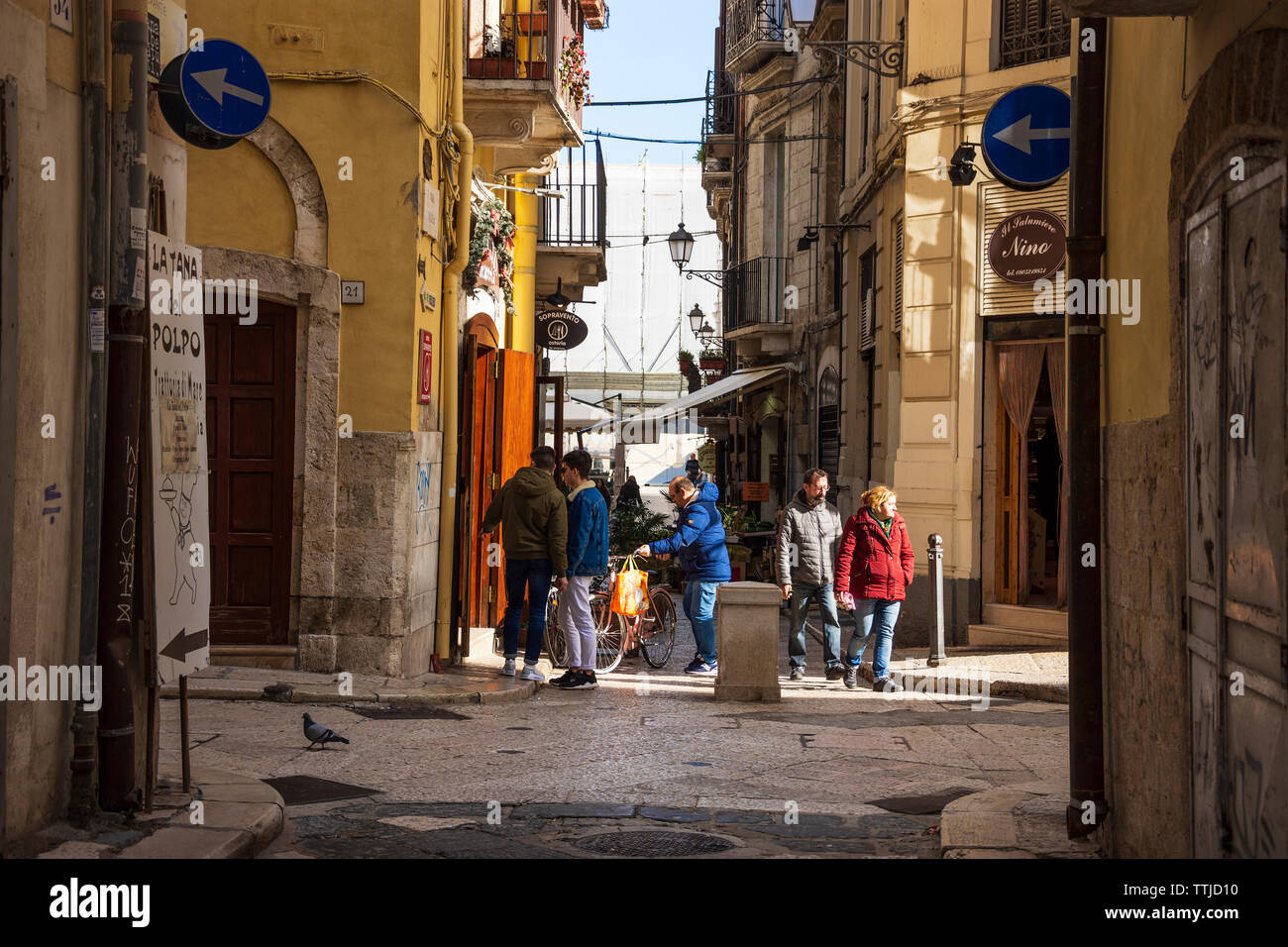 BARI, ITALY - FEBRUARY 9, 2019. Typical picturesque narrow street in ...