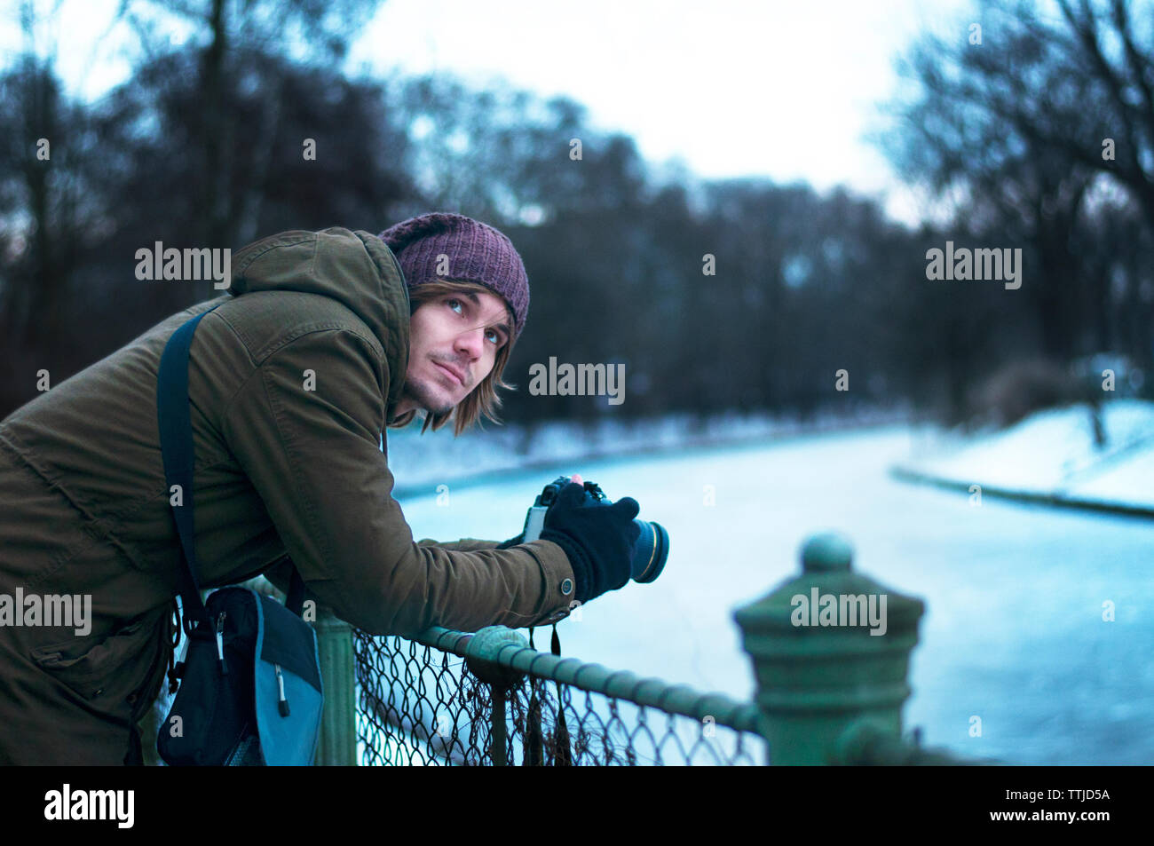 Man on railing hi-res stock photography and images - Alamy