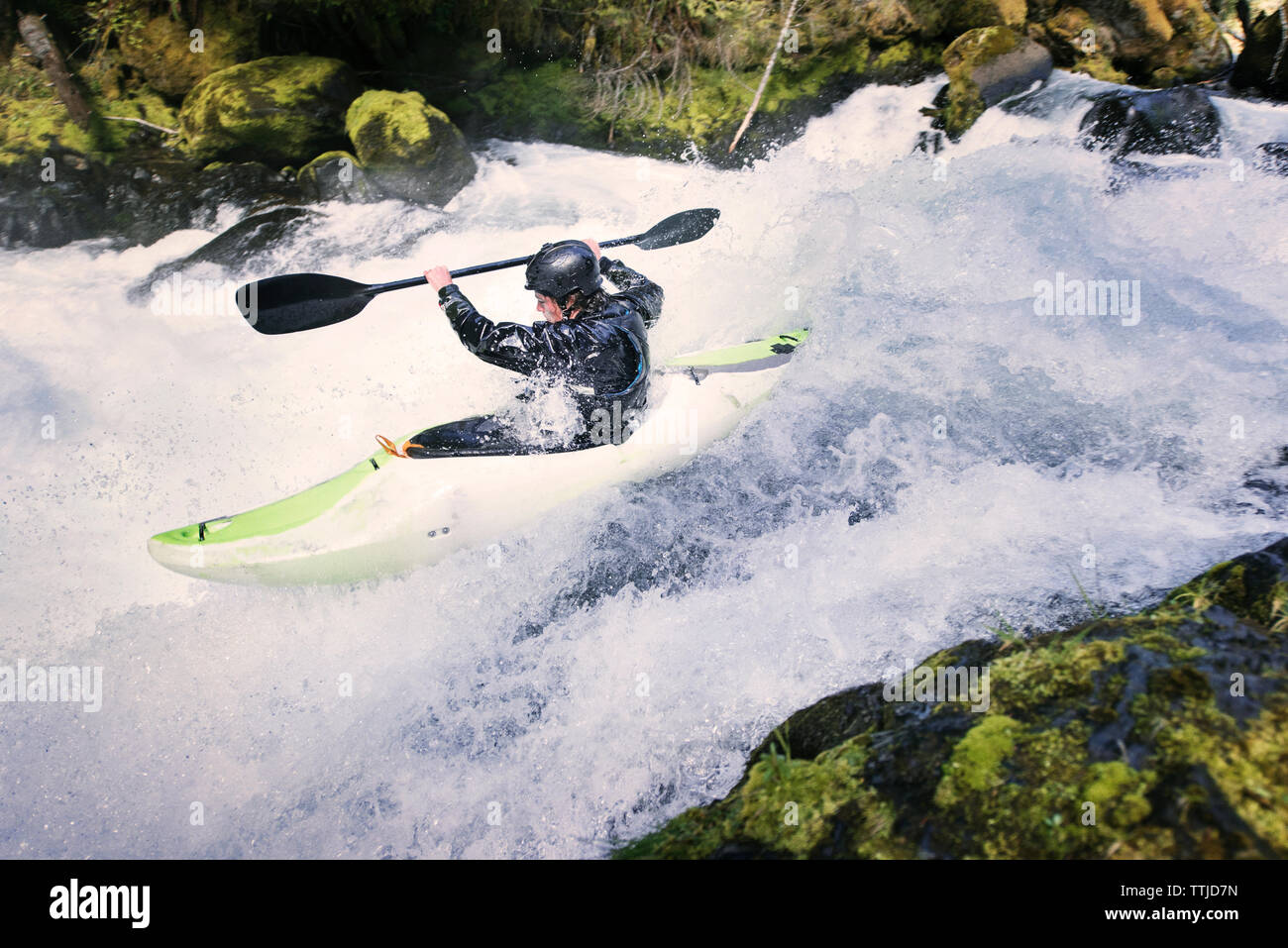 Side view of man kayaking at river Stock Photo - Alamy