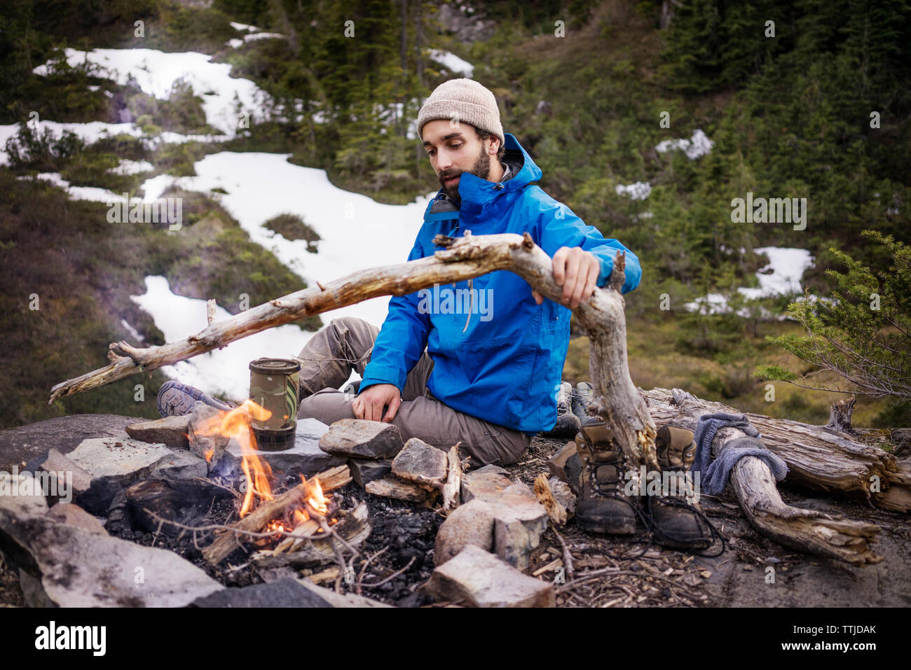 Man burning campfire Stock Photo - Alamy