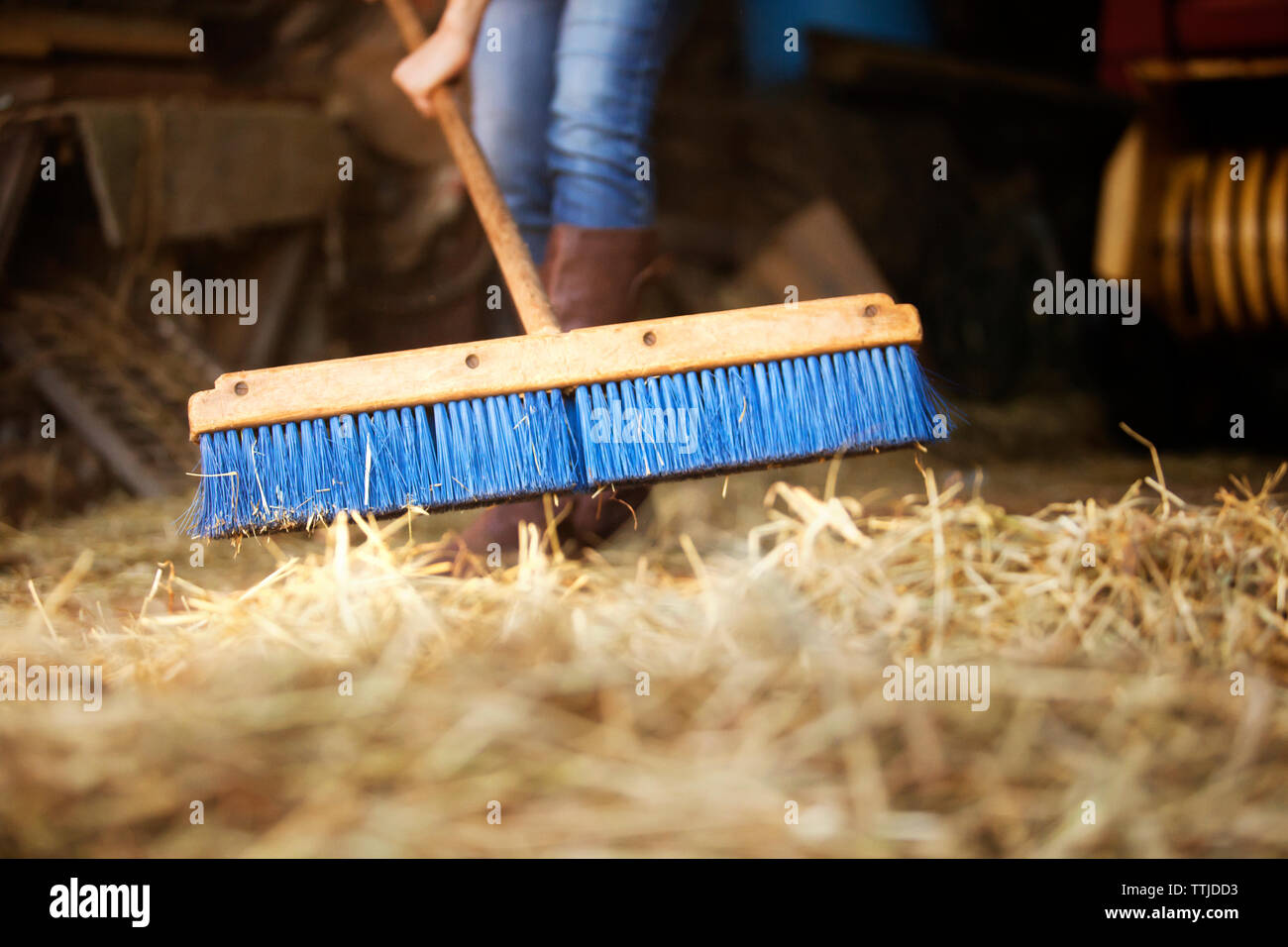 Woman sweeping broom hi-res stock photography and images - Alamy