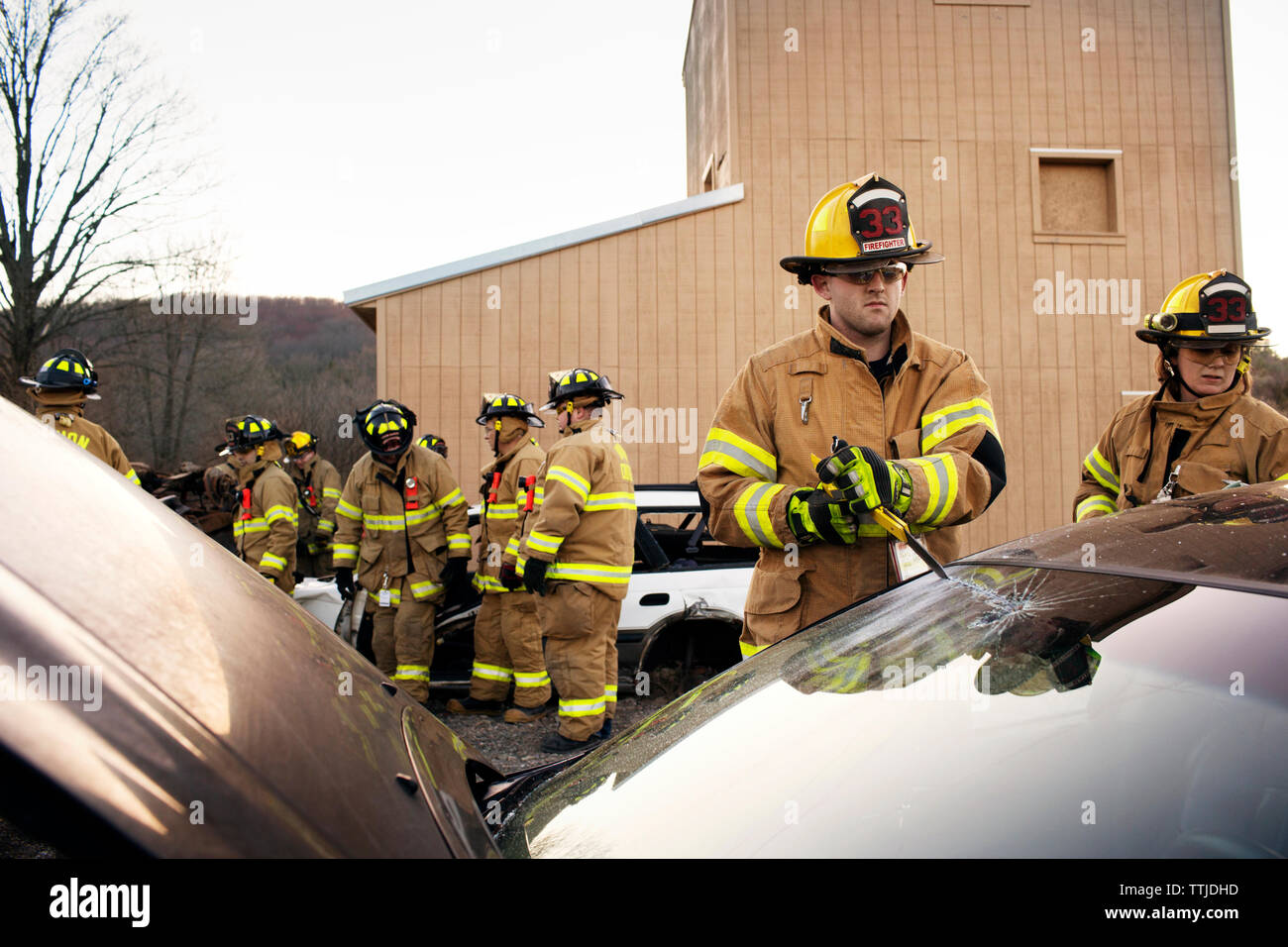 Firefighters rescuing at accident Stock Photo - Alamy