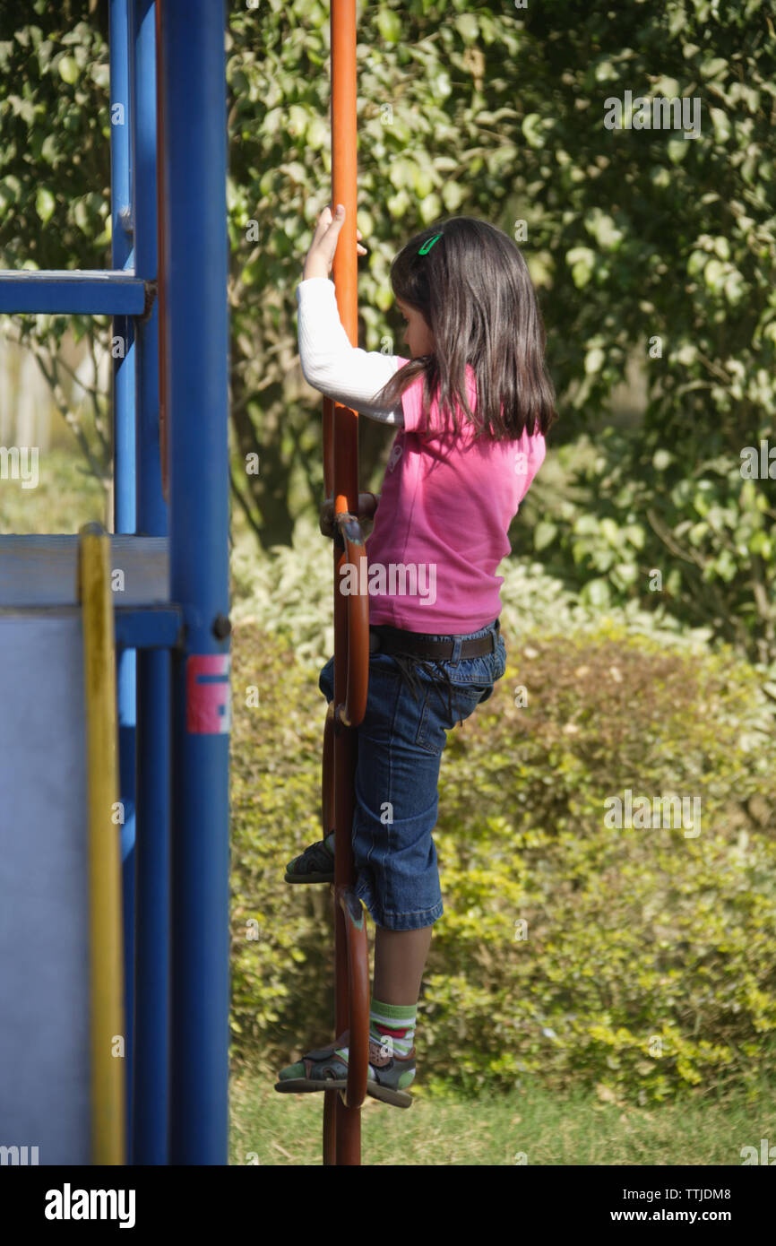 Child climbing up slide hi-res stock photography and images - Alamy