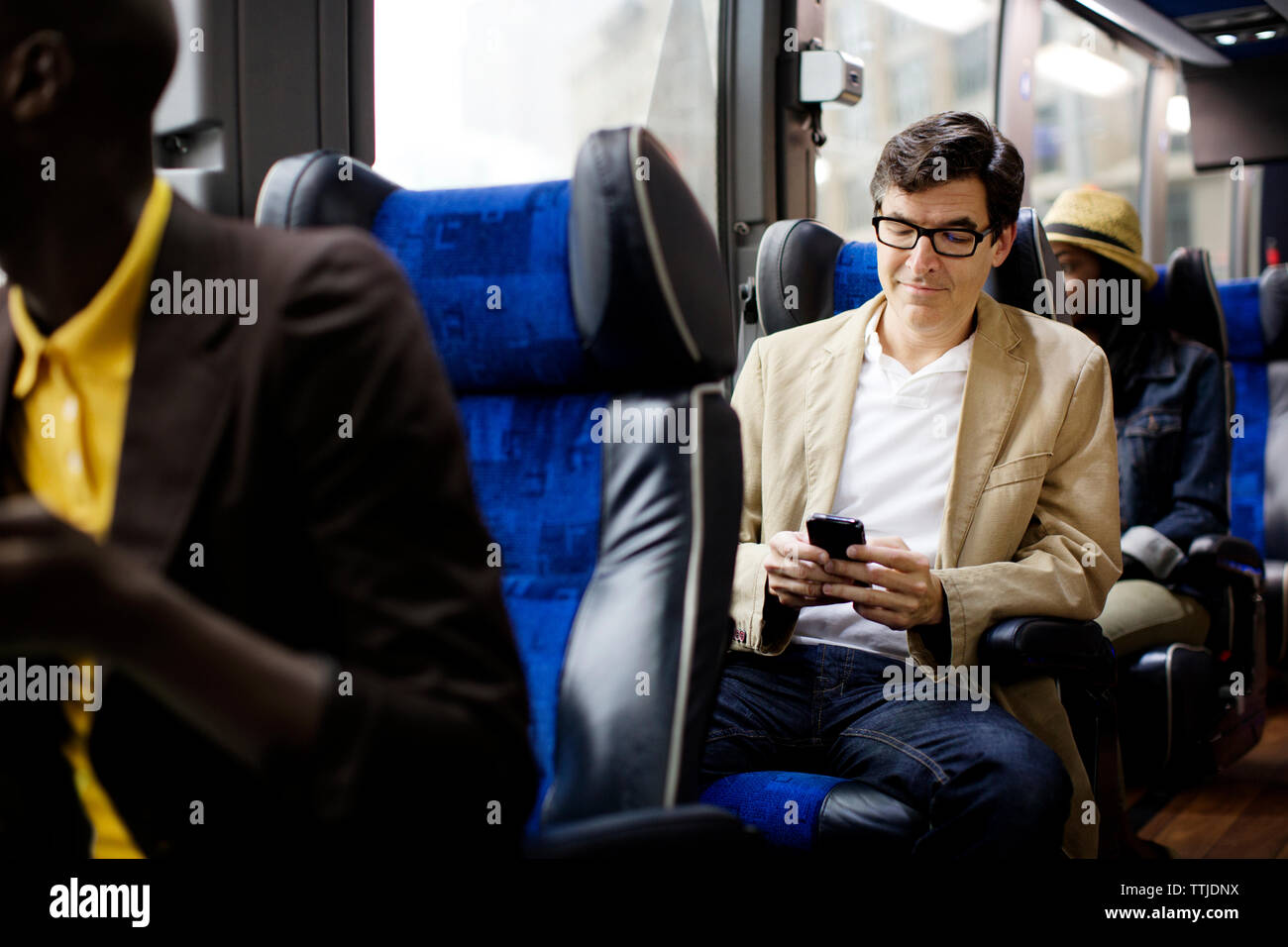 Old man bus phone hi-res stock photography and images - Alamy