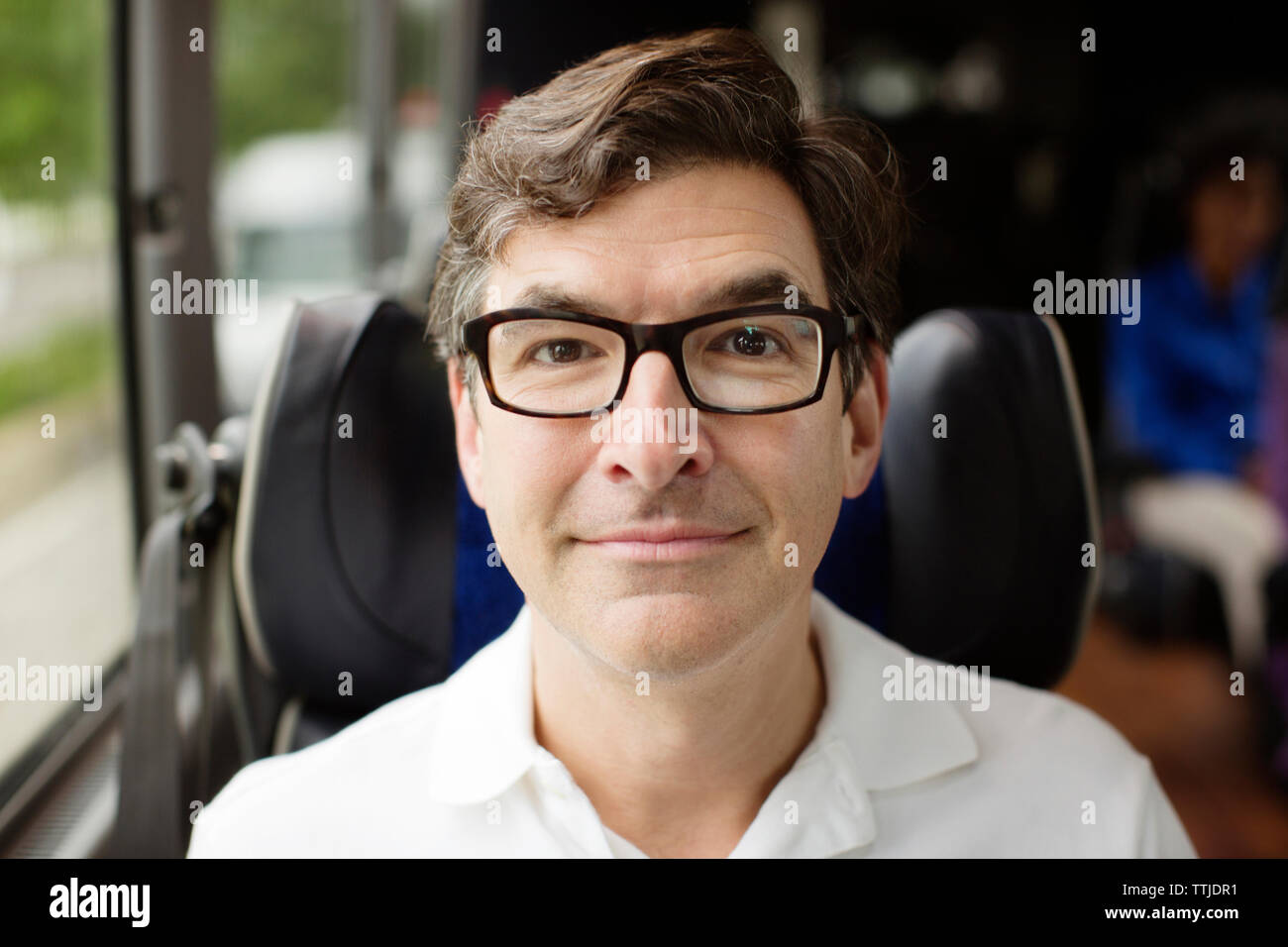 Portrait of man sitting in bus Stock Photo - Alamy