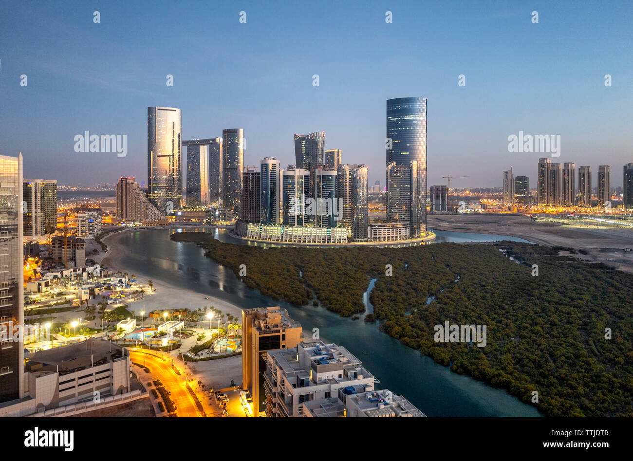 Sunset over City of Lights area of Reem Island in Abu Dhabi, UAE Stock ...