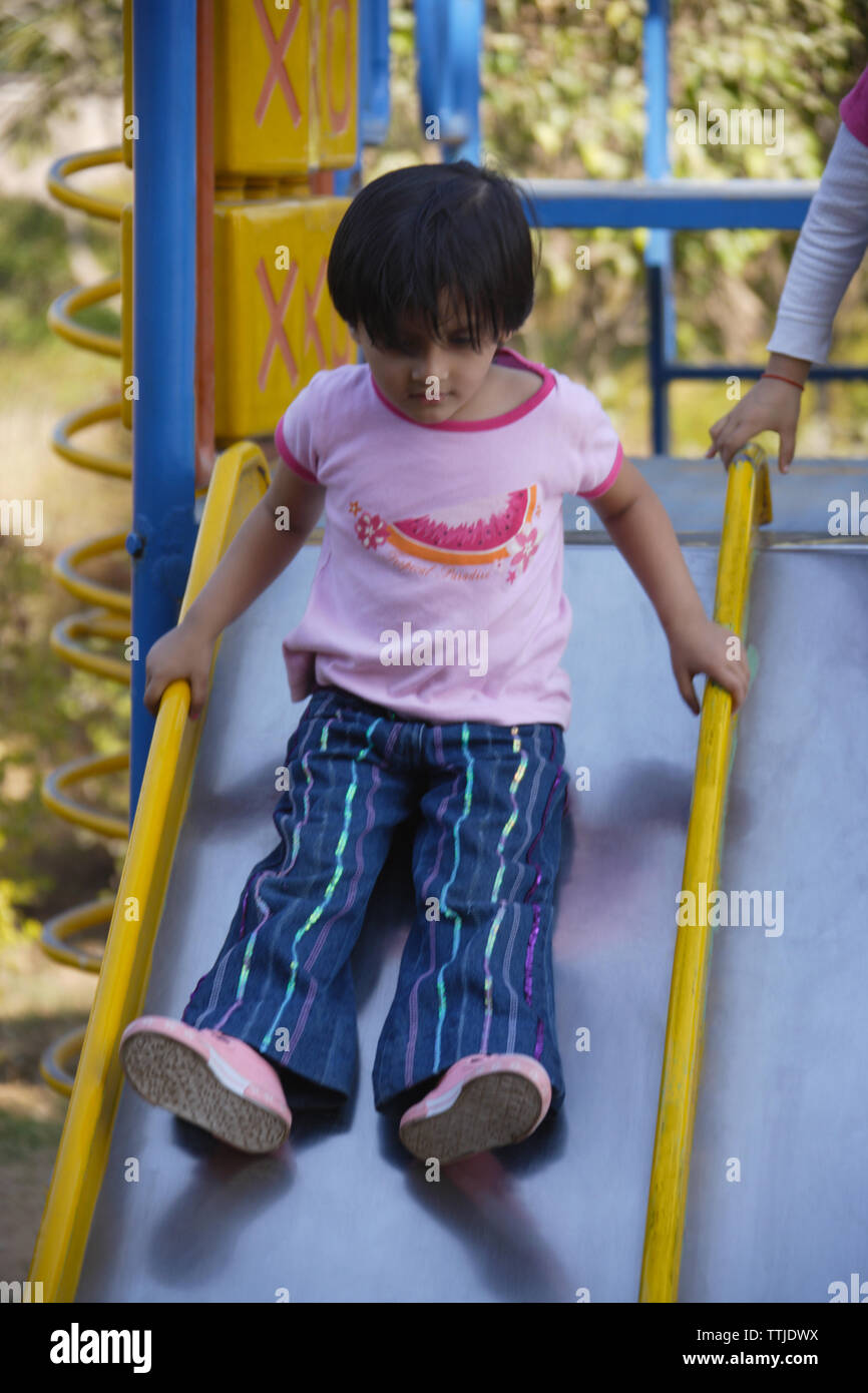 Girl sliding down the slide hi-res stock photography and images - Alamy