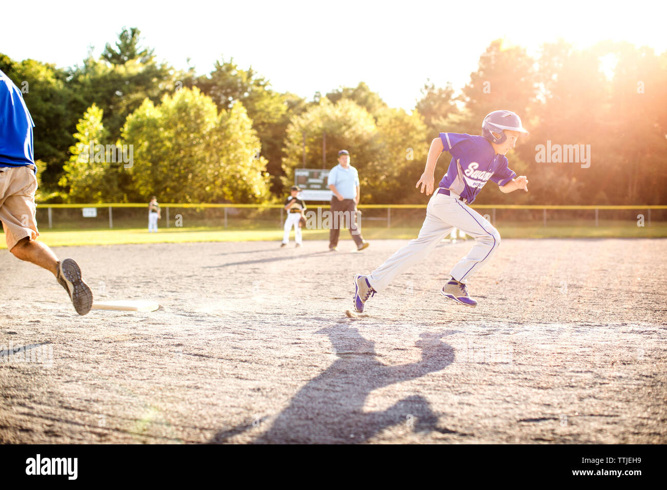 Baseball player running on field Stock Photo - Alamy