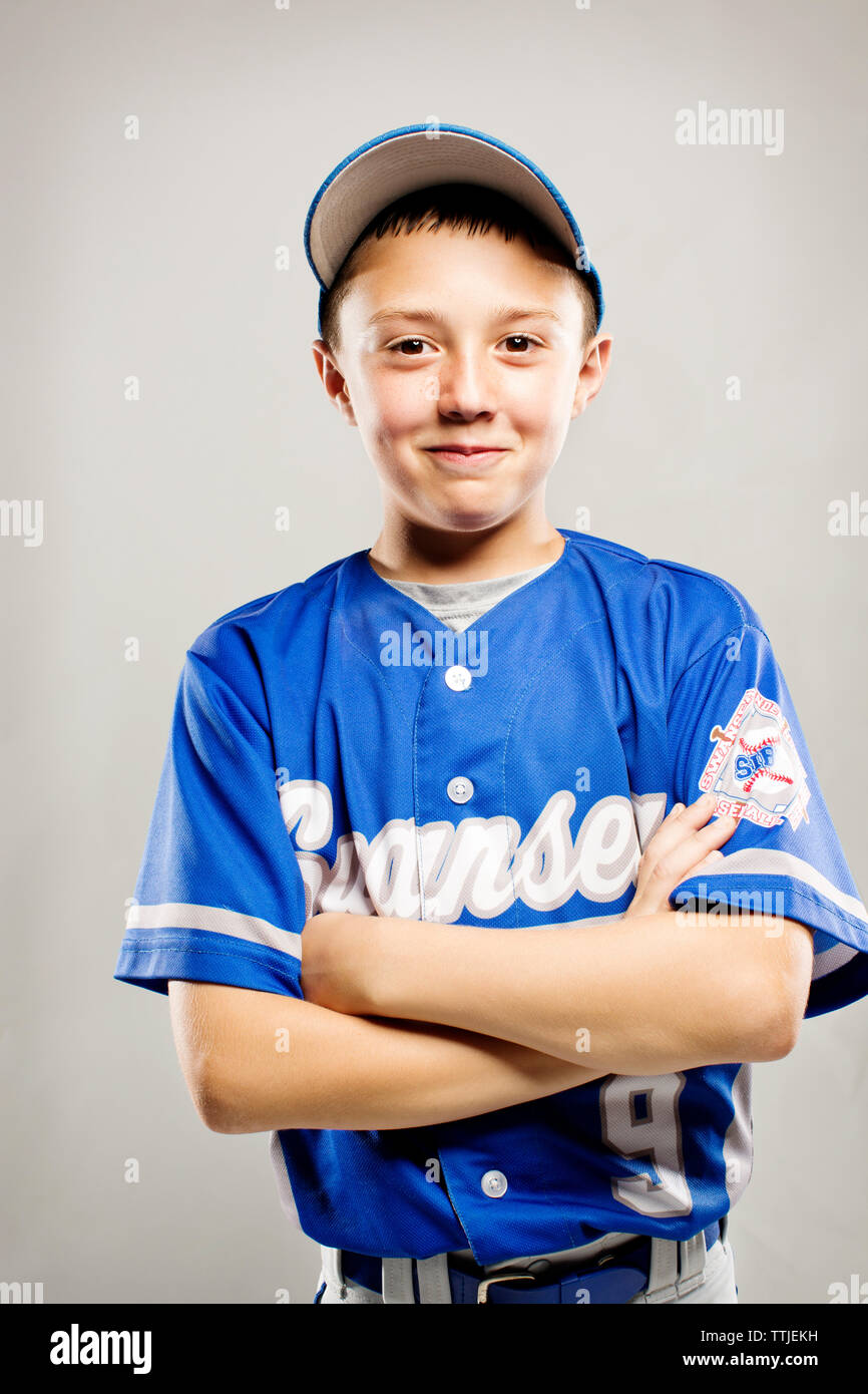 Portrait of confident boy against white background Stock Photo - Alamy