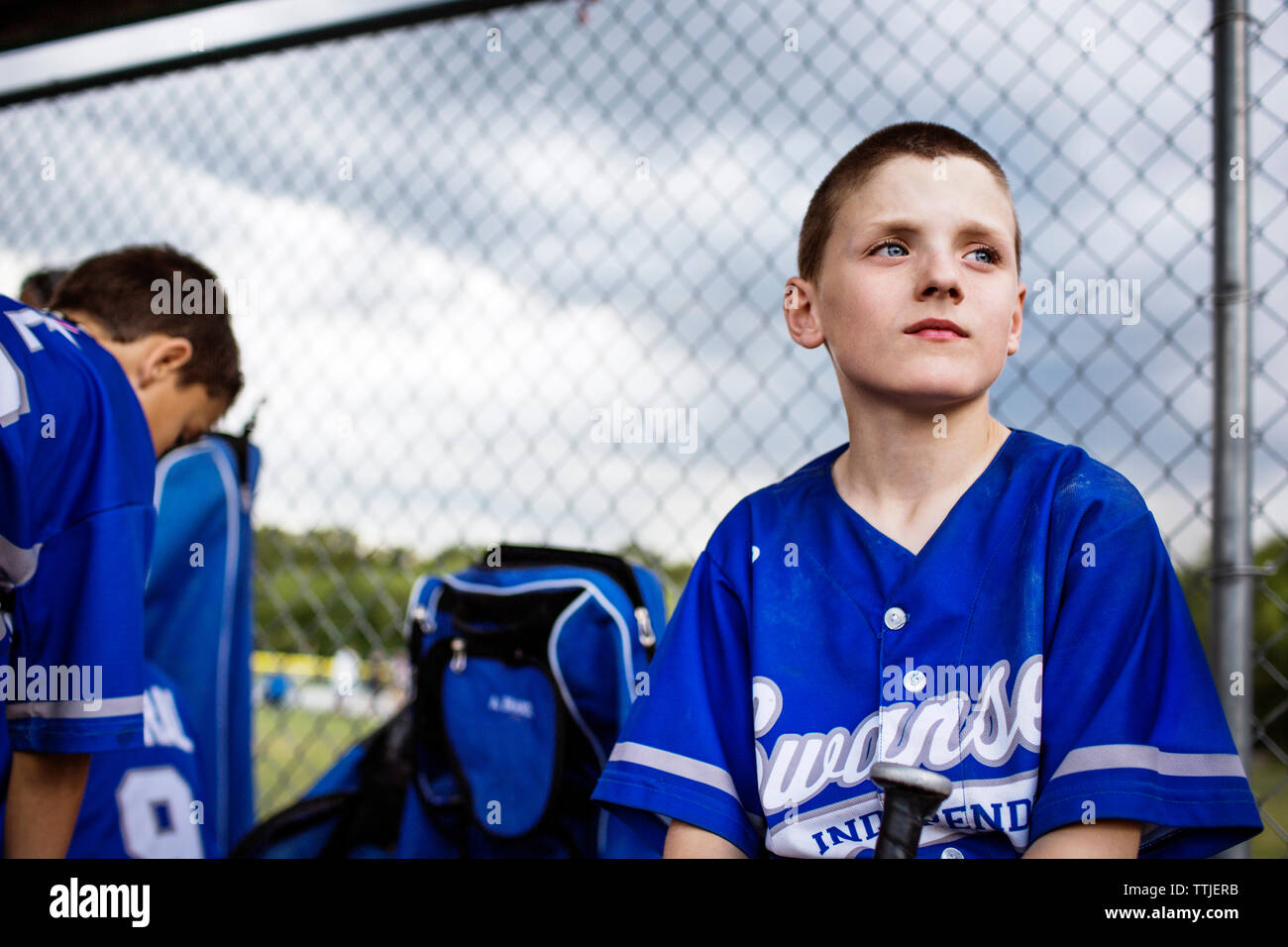 Baseball player sitting in dugout hi-res stock photography and images ...