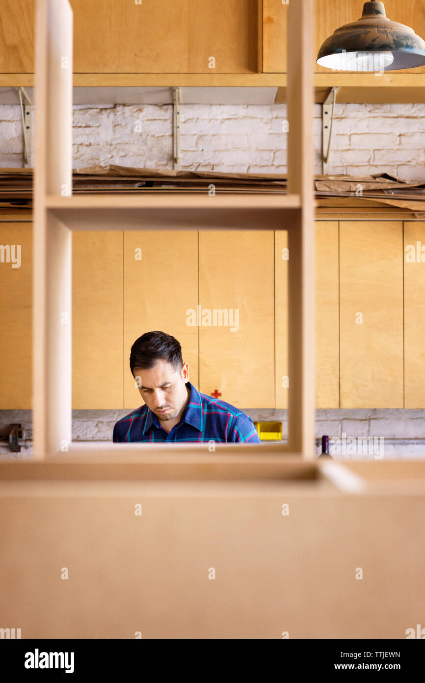 Carpenter working in workshop Stock Photo - Alamy