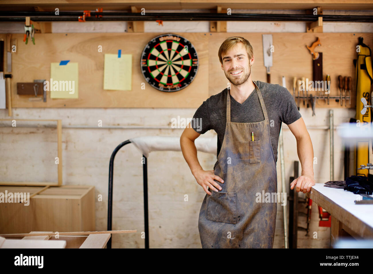 Portrait of craftsperson standing in workshop Stock Photo - Alamy