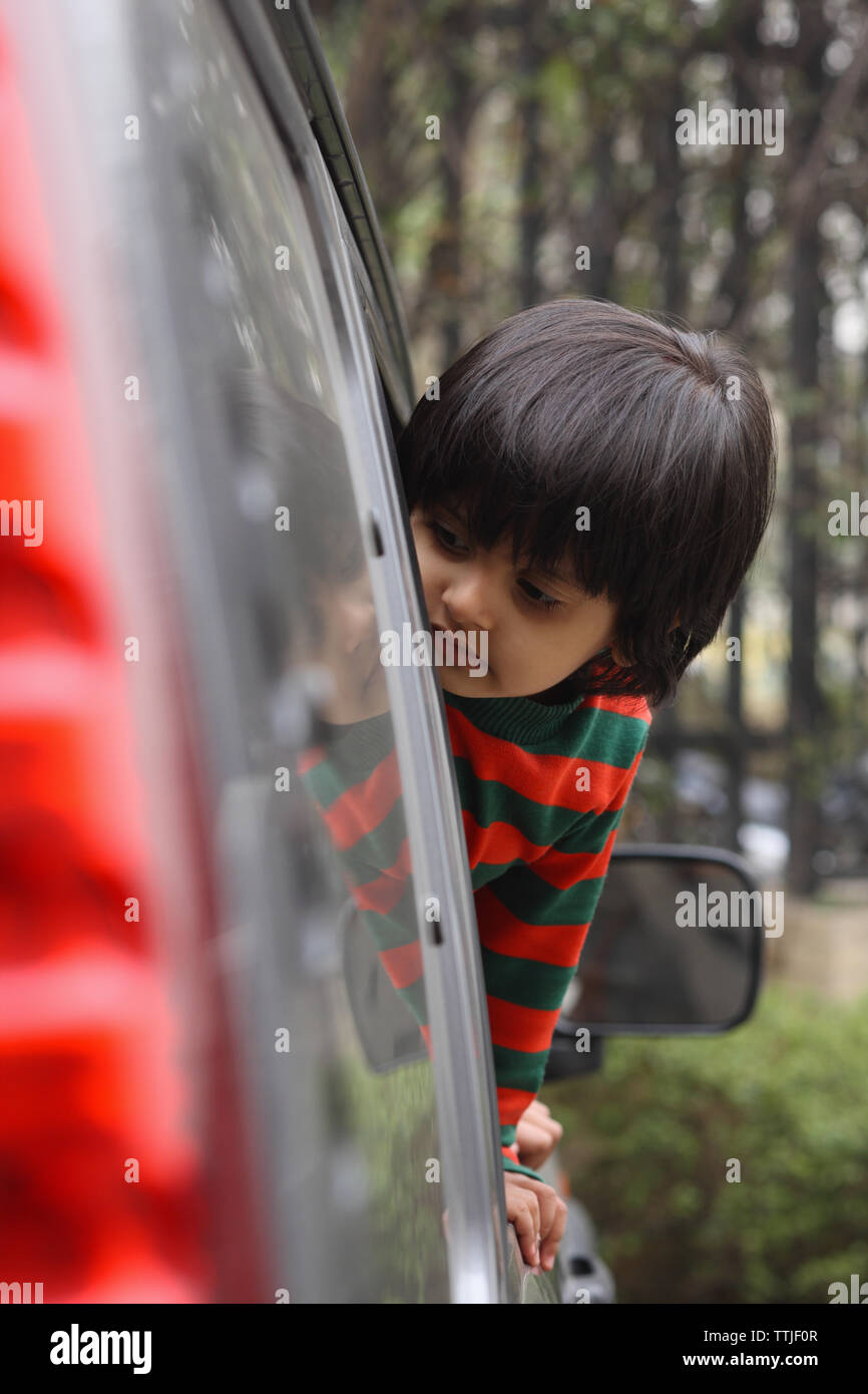 Child leaning out of car hi-res stock photography and images - Alamy