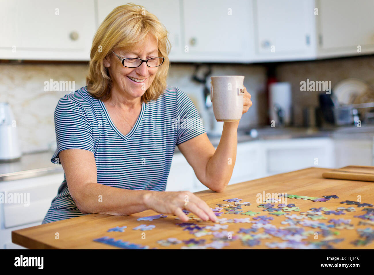 Happy puzzle hi-res stock photography and images - Alamy