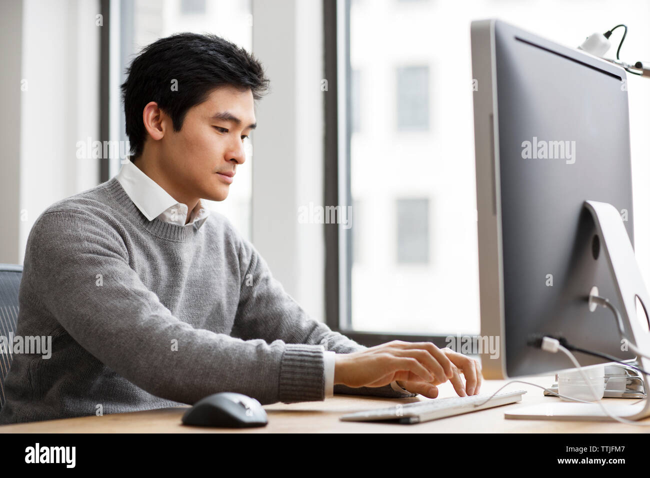 Typing desktop computer hi-res stock photography and images - Alamy