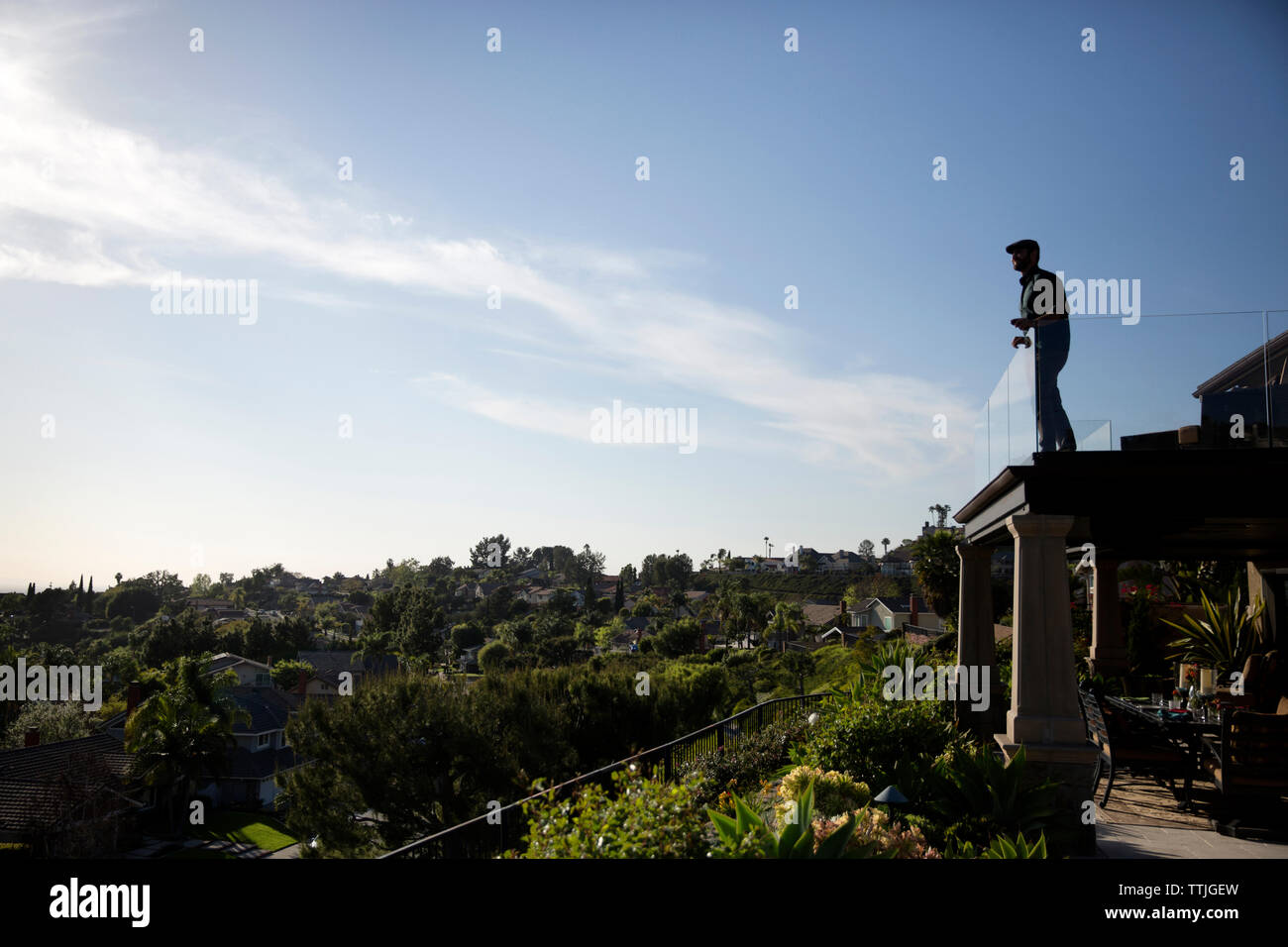 Man standing in balcony hi-res stock photography and images - Alamy
