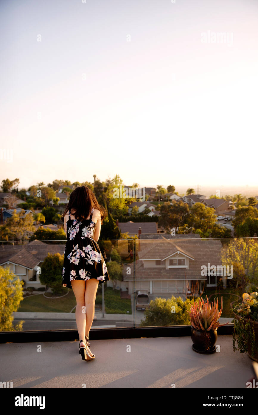 Woman leaning on railing hi-res stock photography and images - Alamy