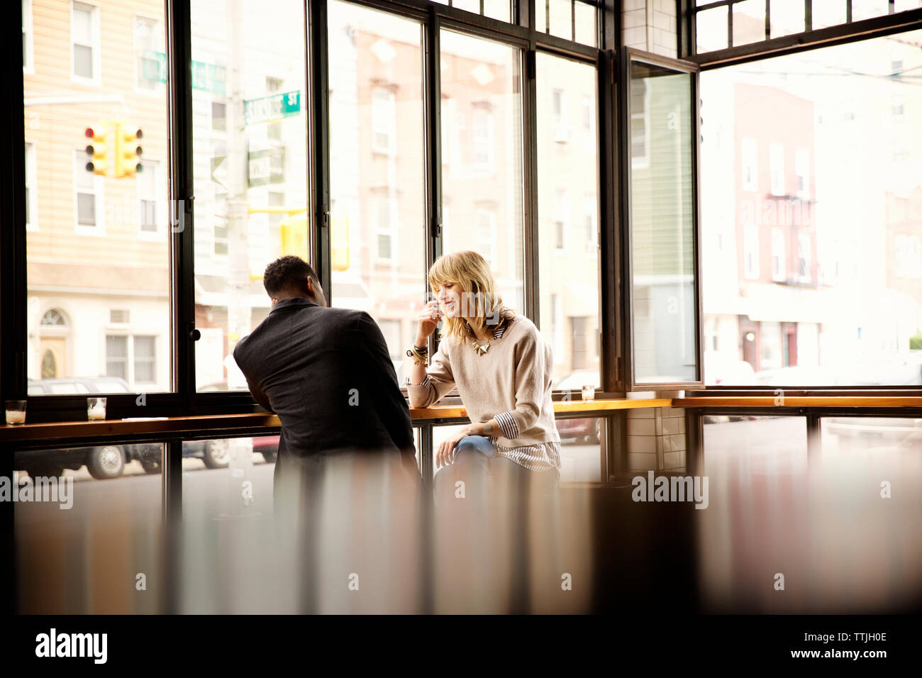 Friends in sitting bar Stock Photo - Alamy