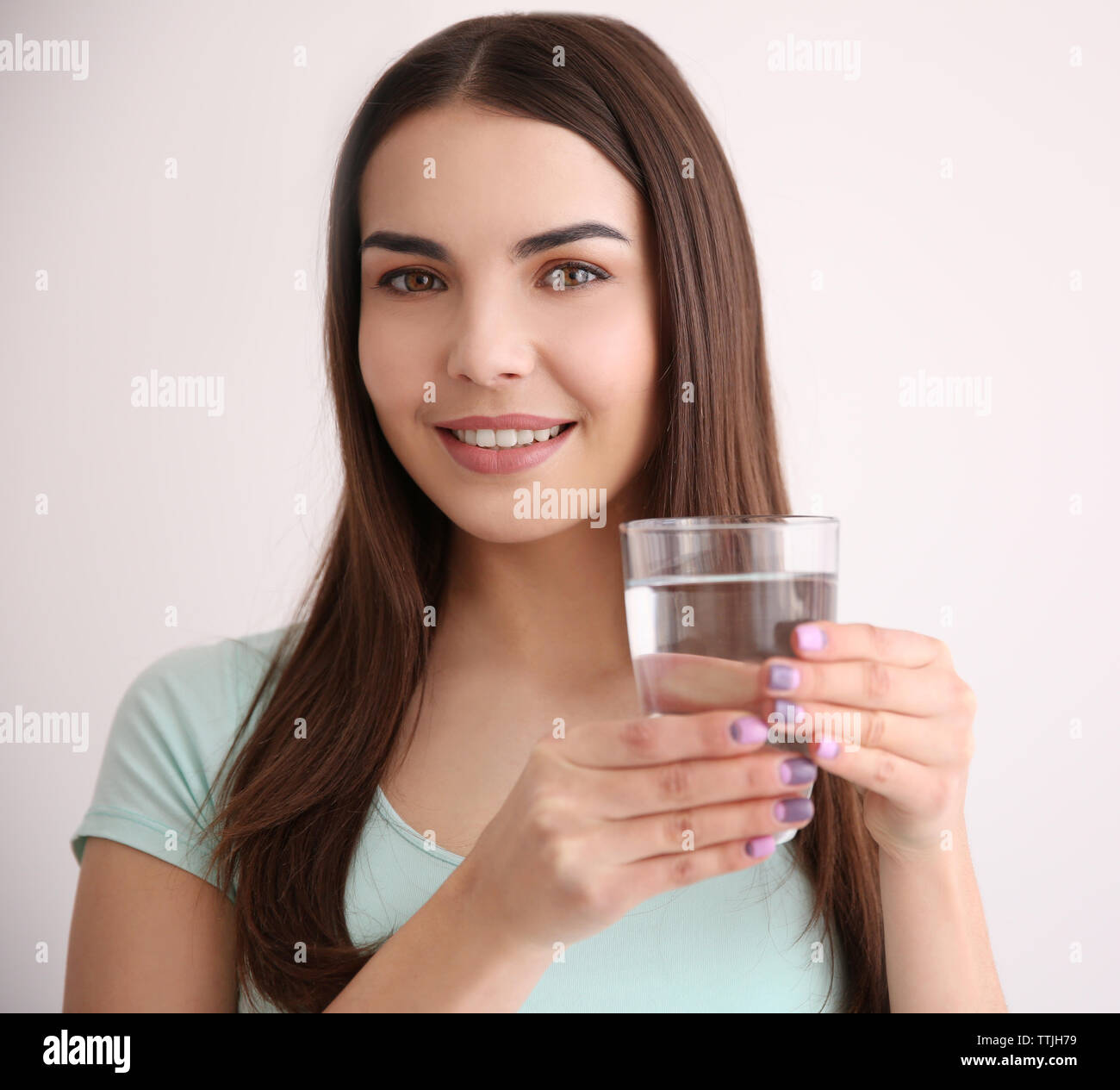 Beautiful girl drinking water Stock Photo - Alamy